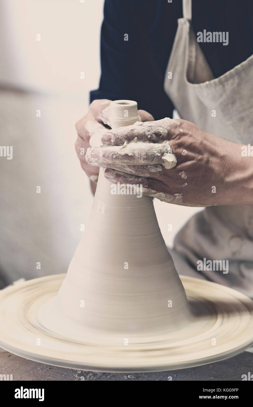 Potter makes pottery handmade in the workshop Stock Photo - Alamy