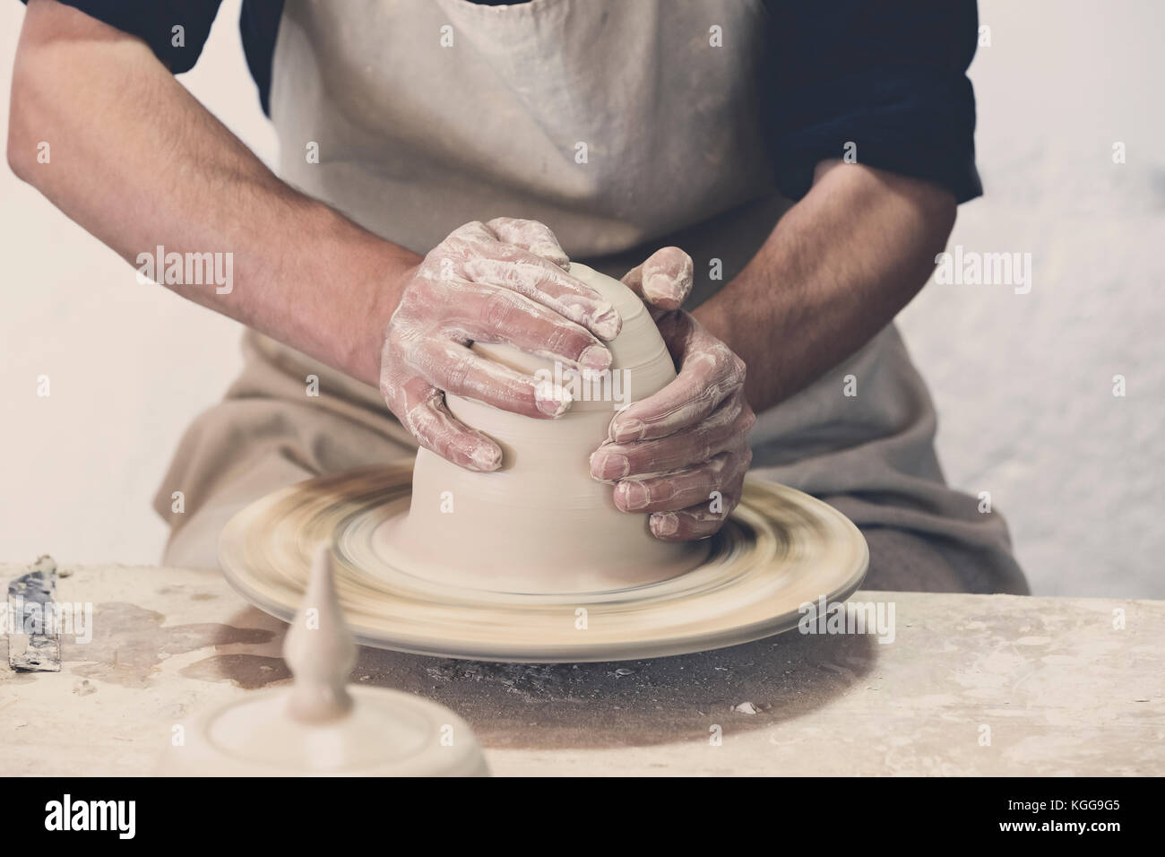 Potter makes pottery handmade in the workshop Stock Photo - Alamy