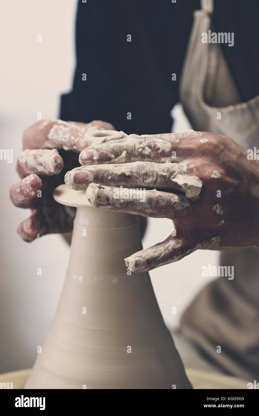 Potter makes pottery handmade in the workshop Stock Photo - Alamy