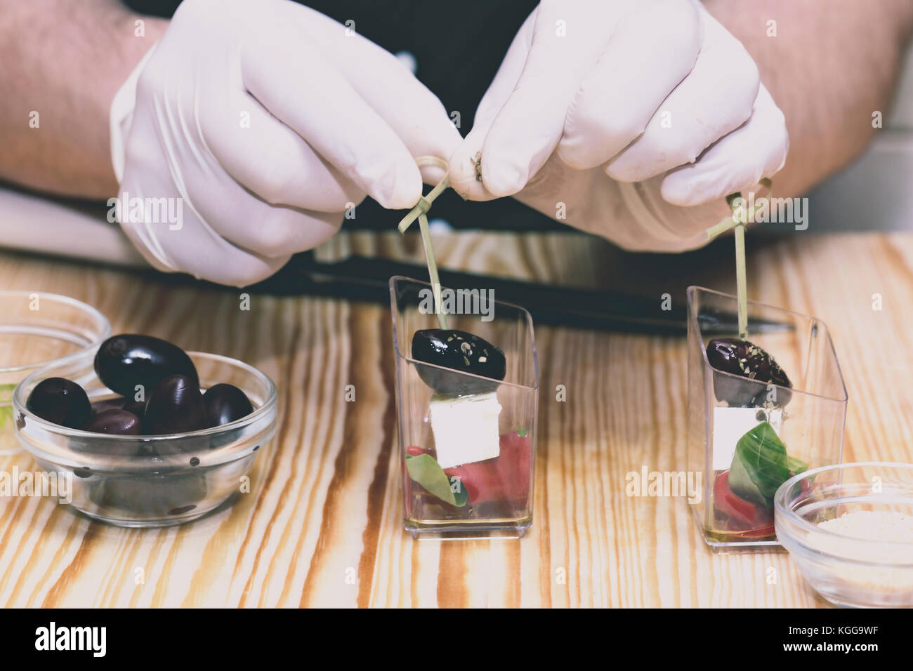 Cook preparing canapes in the kitchen at the restaurant Stock Photo - Alamy