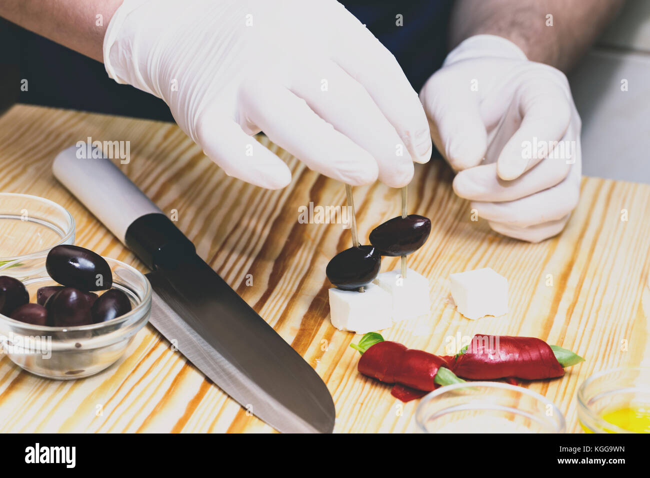 Cook preparing canapes in the kitchen at the restaurant Stock Photo - Alamy