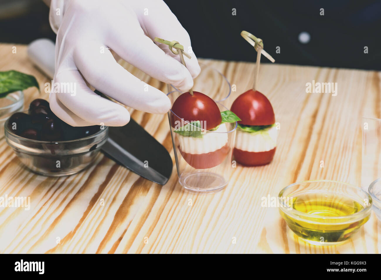 Cook preparing canapes in the kitchen at the restaurant Stock Photo - Alamy