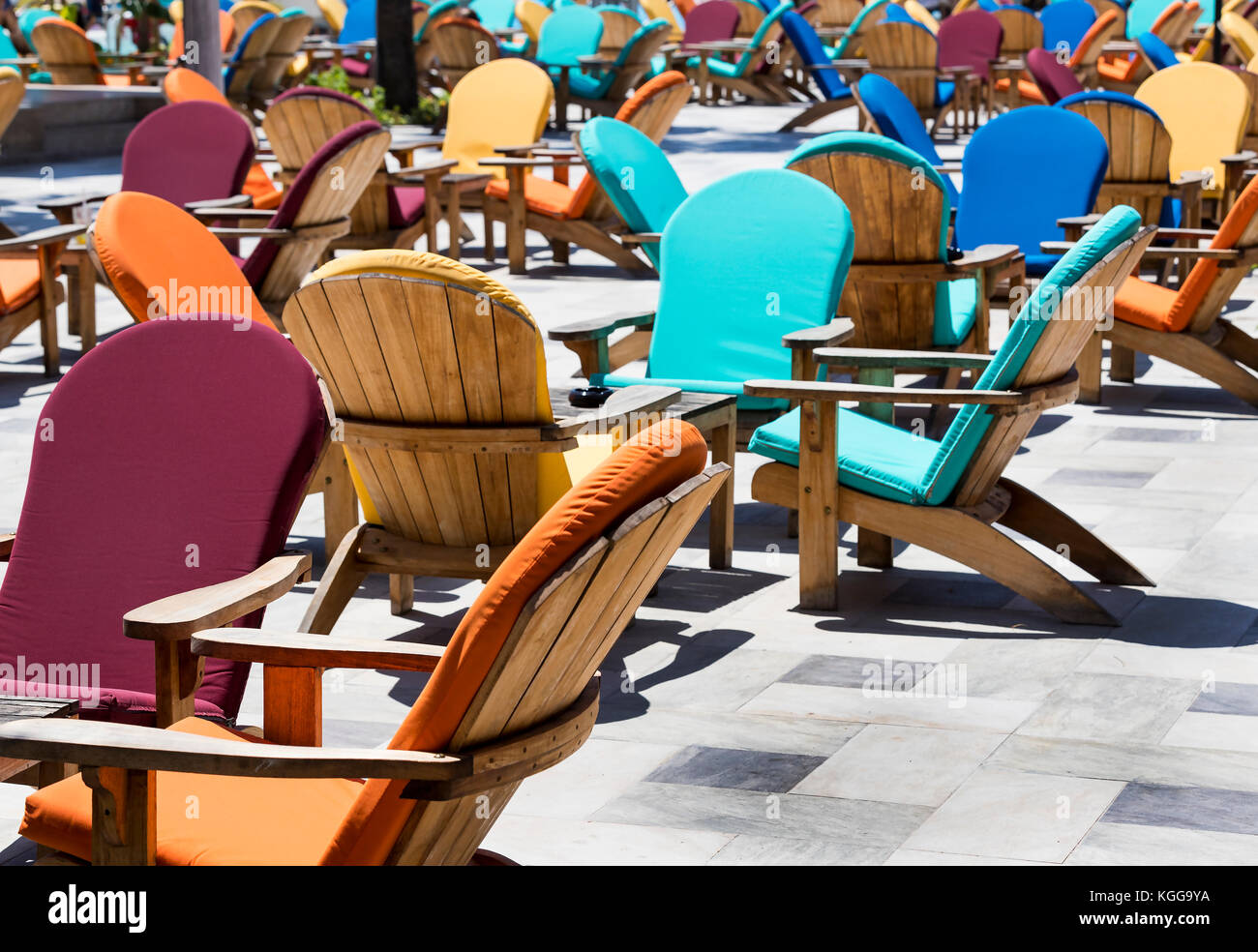 Wooden chairs with colored upholstery with wooden tables Stock Photo ...