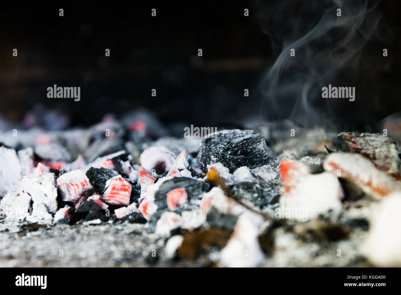 Hot coal, embers of the grill and smoke close up Stock Photo - Alamy