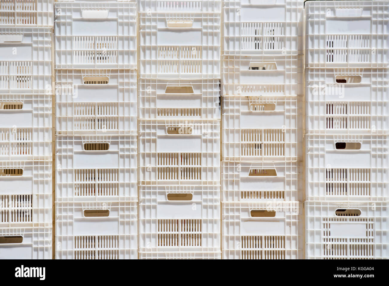 Background of white plastic boxes stacked in stock Stock Photo - Alamy
