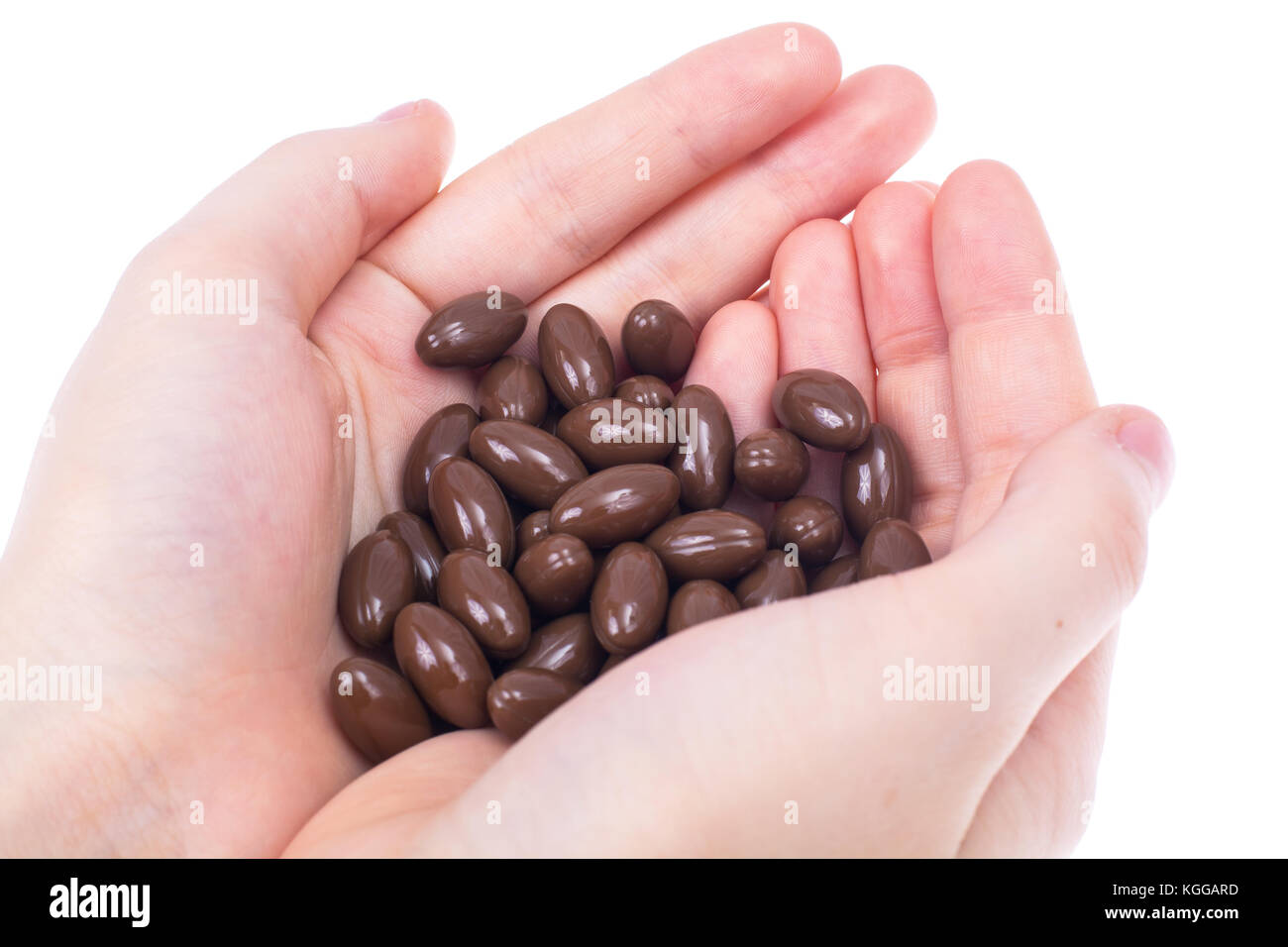 Concept medicine. Brown capsules in the palms of the hands. Studio ...