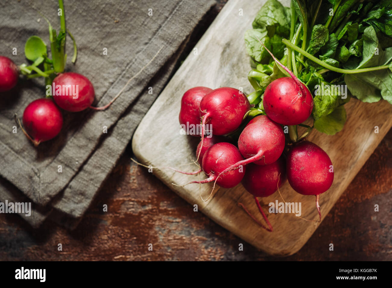 Delicious fresh radishes on a rustic background Stock Photo - Alamy