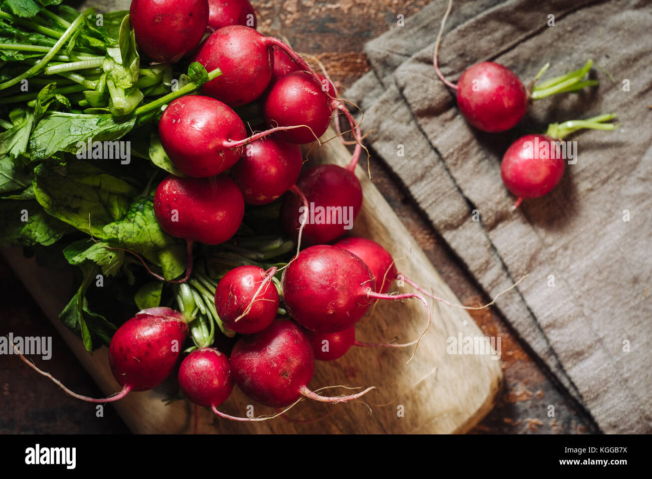 Delicious fresh radishes on a rustic background Stock Photo - Alamy