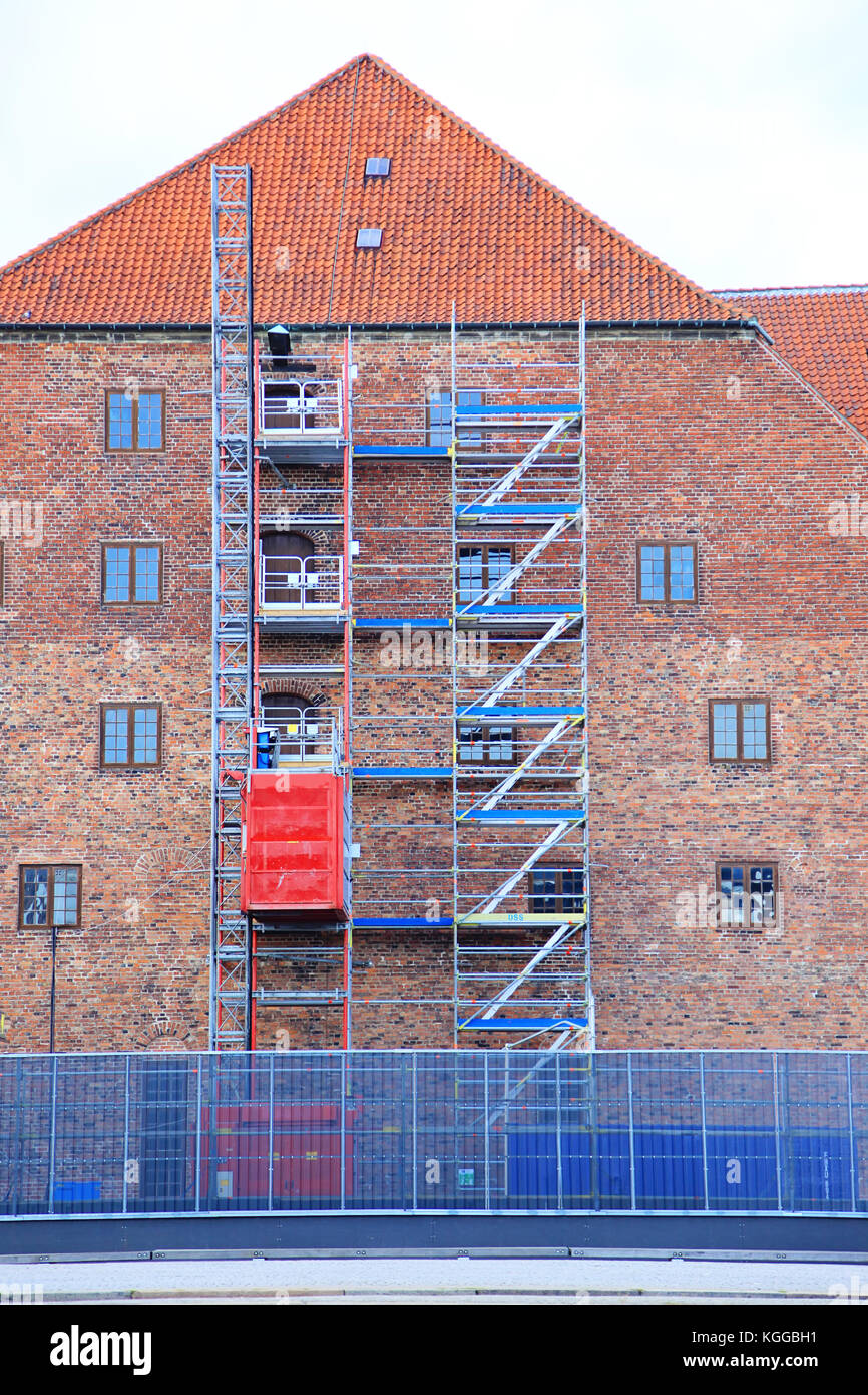 red brick house with scaffold in Copenhagen, traditional architecture ...
