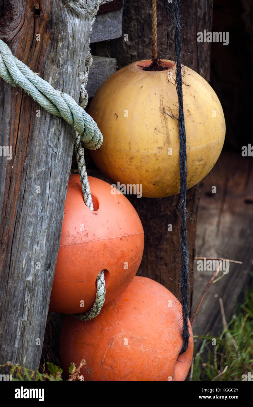 Weathered old floats on the quay Stock Photo - Alamy