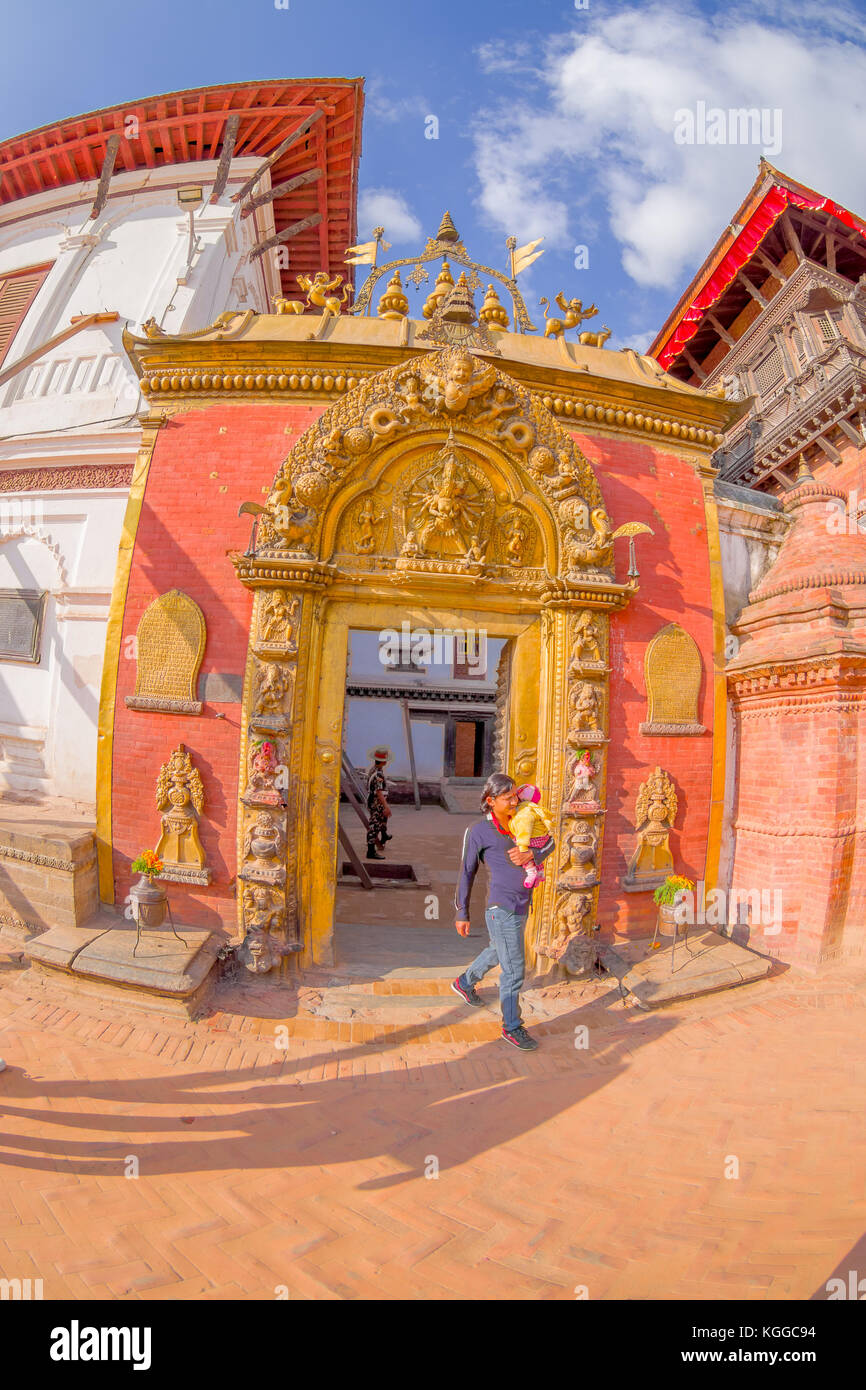 BHAKTAPUR, NEPAL - NOVEMBER 04, 2017: Beautiful golden door of a temple ...