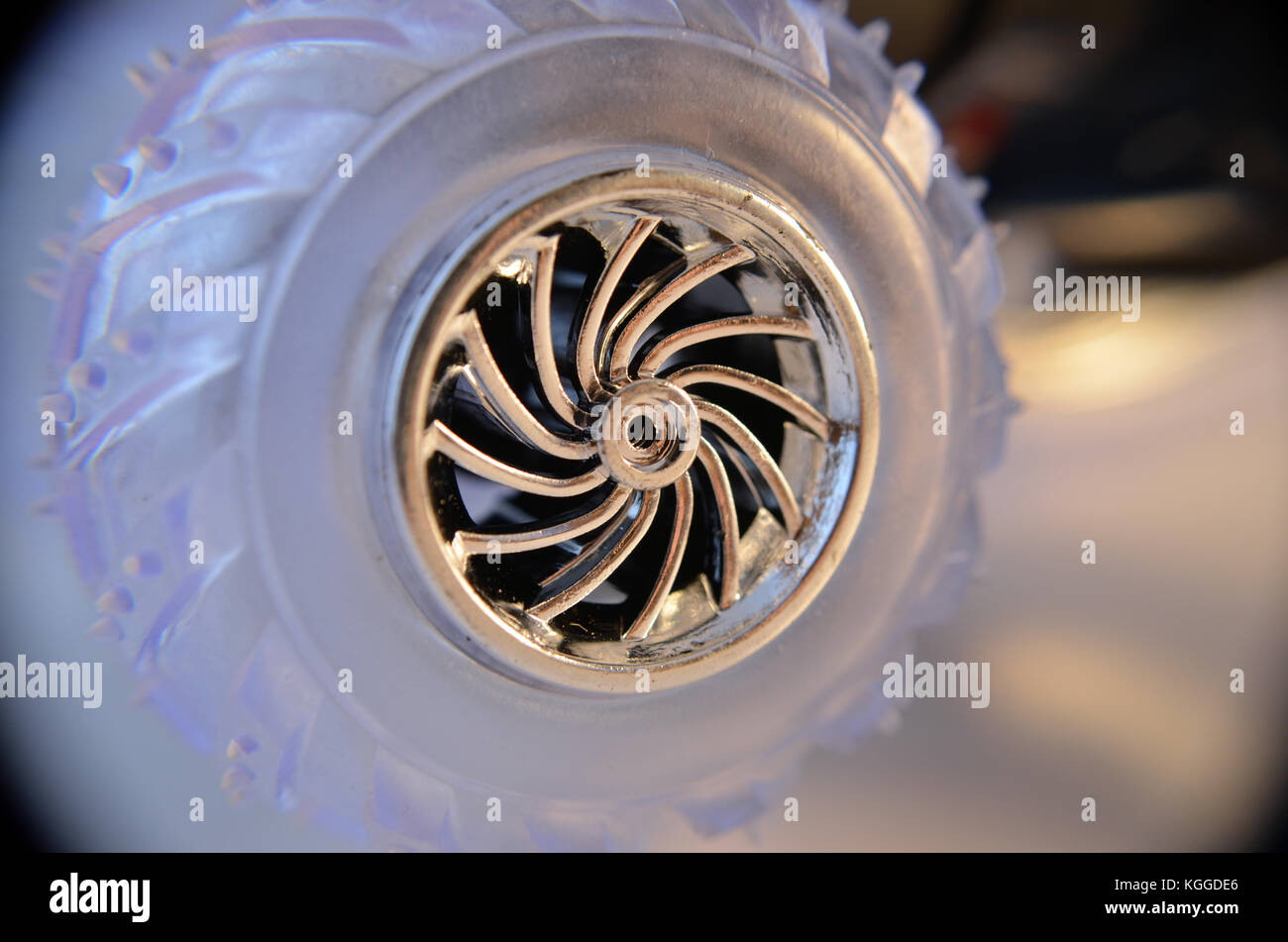 A clear toy tire with a silver spiral wheel Stock Photo - Alamy