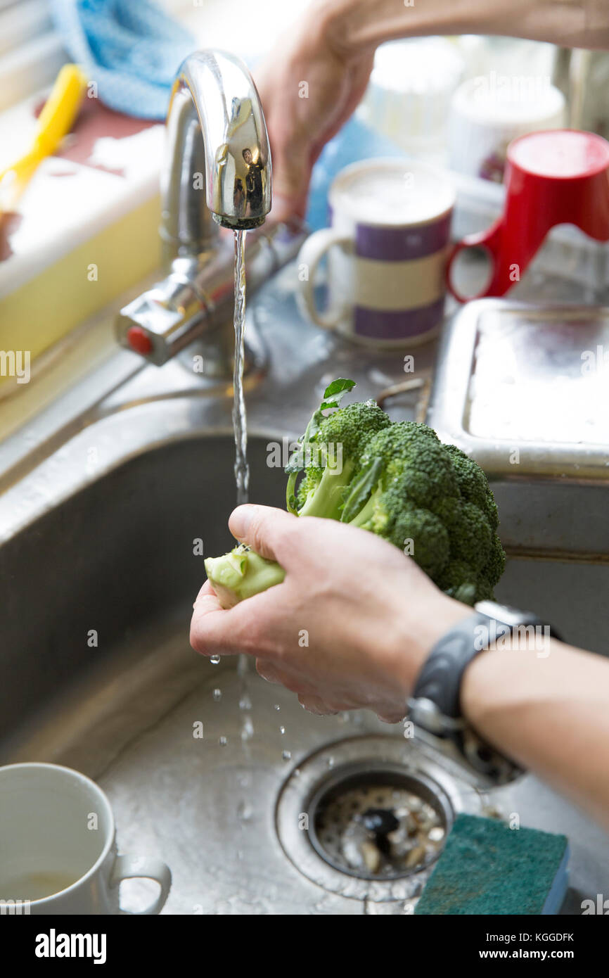 preparing broccoli in kitchen Stock Photo - Alamy