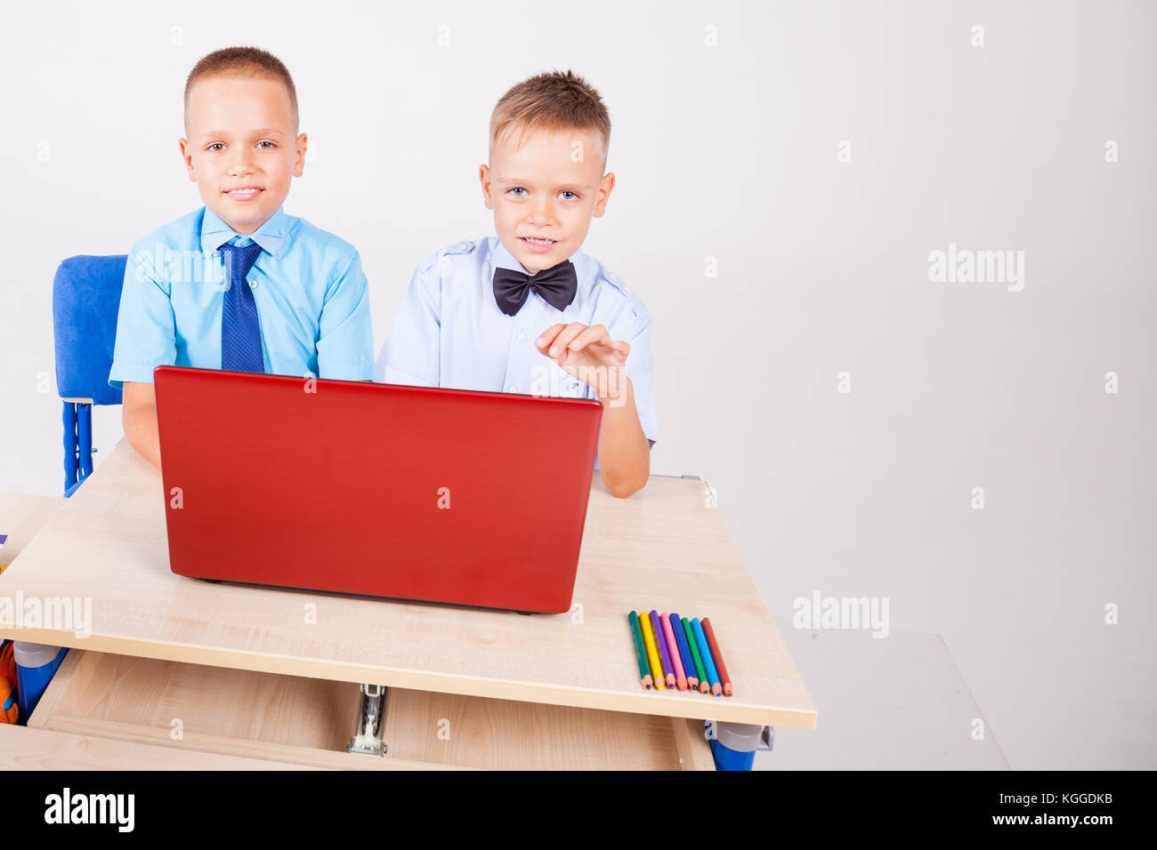 study on the computer two boys at school Stock Photo - Alamy