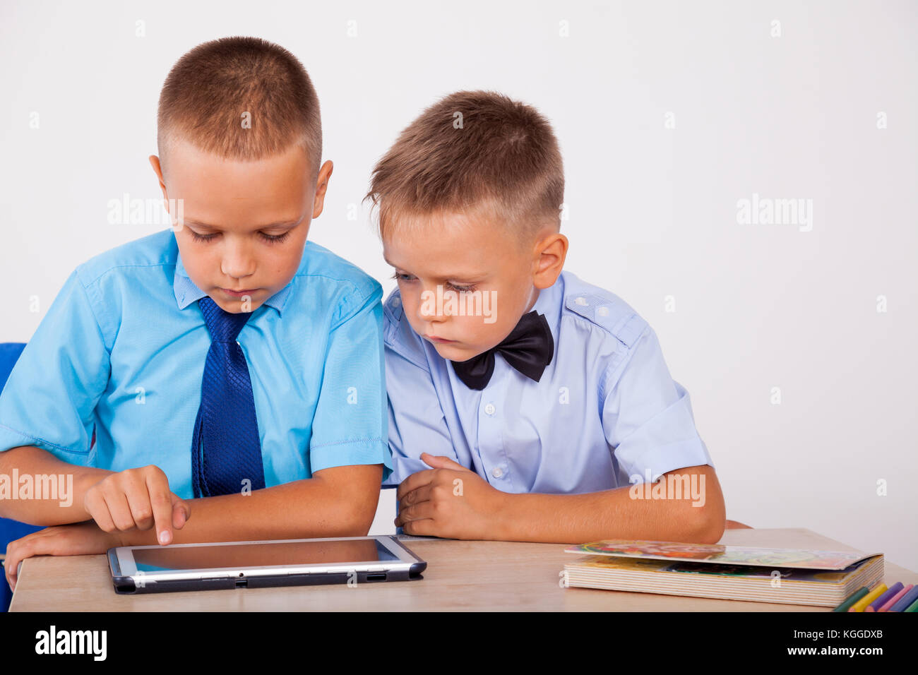 boys learn lessons Internet Tablet Stock Photo - Alamy