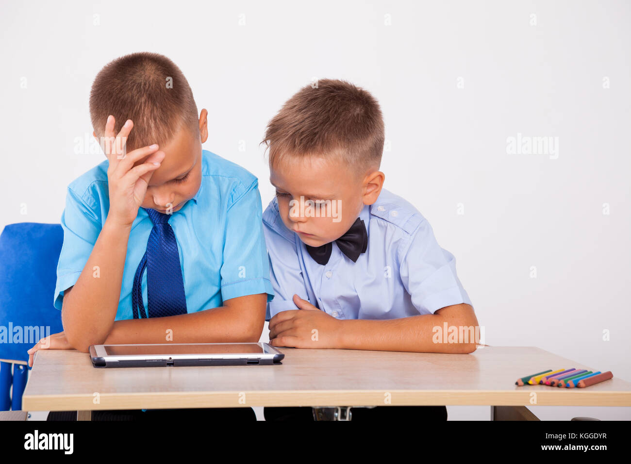 boys learn lessons Internet Tablet Stock Photo - Alamy