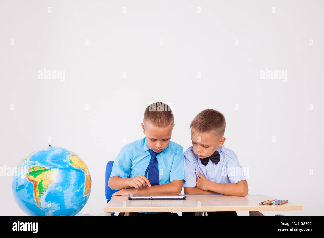 boys learn lessons Internet Tablet Stock Photo - Alamy