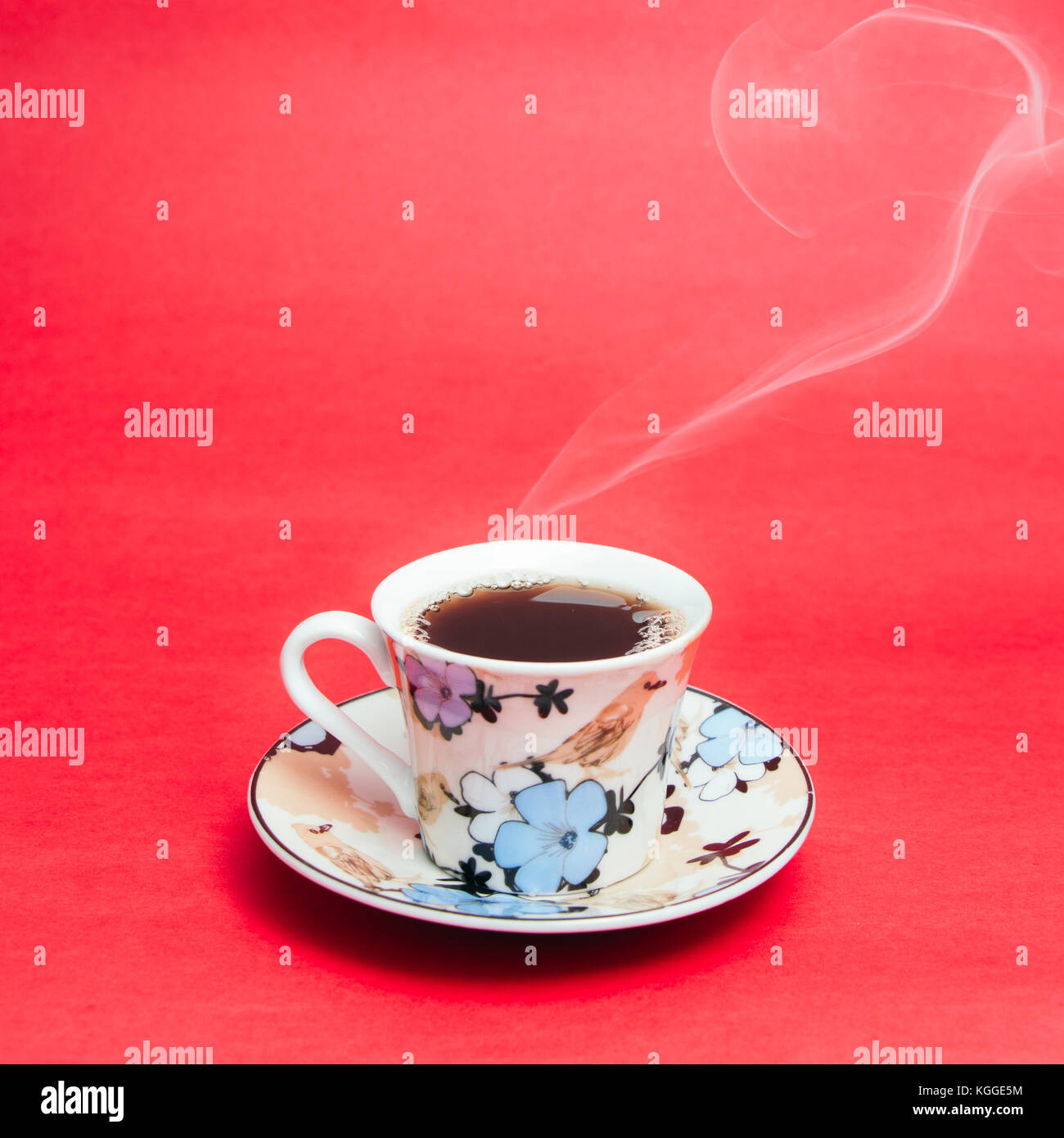 Stamped mug with steaming coffee. Soft smoke. Red background. Square ...