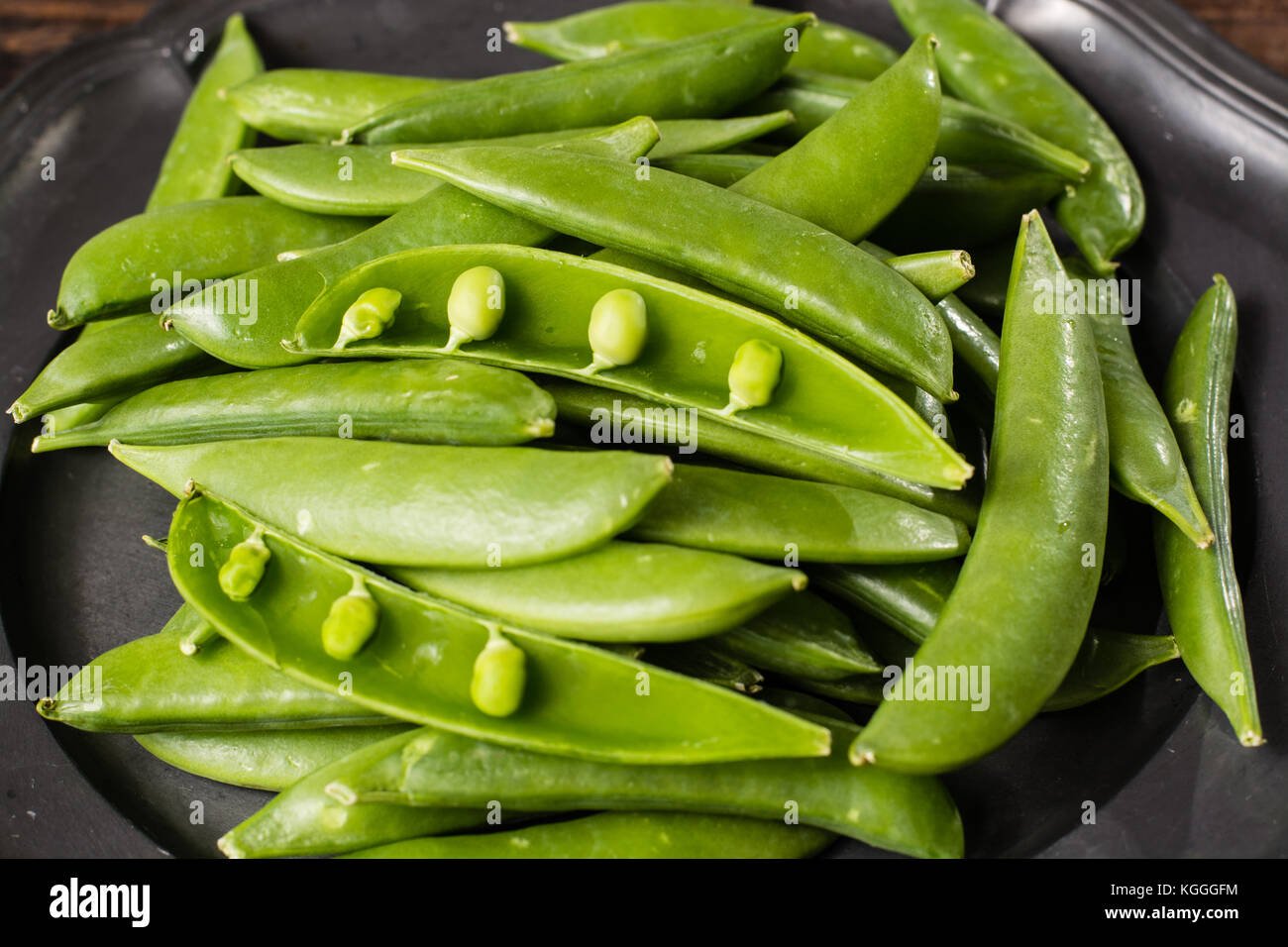 Fresh green sweet pea beans close up Stock Photo - Alamy