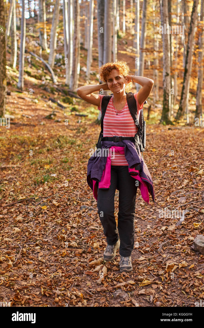 Hiker lady on a trail in the woods Stock Photo - Alamy