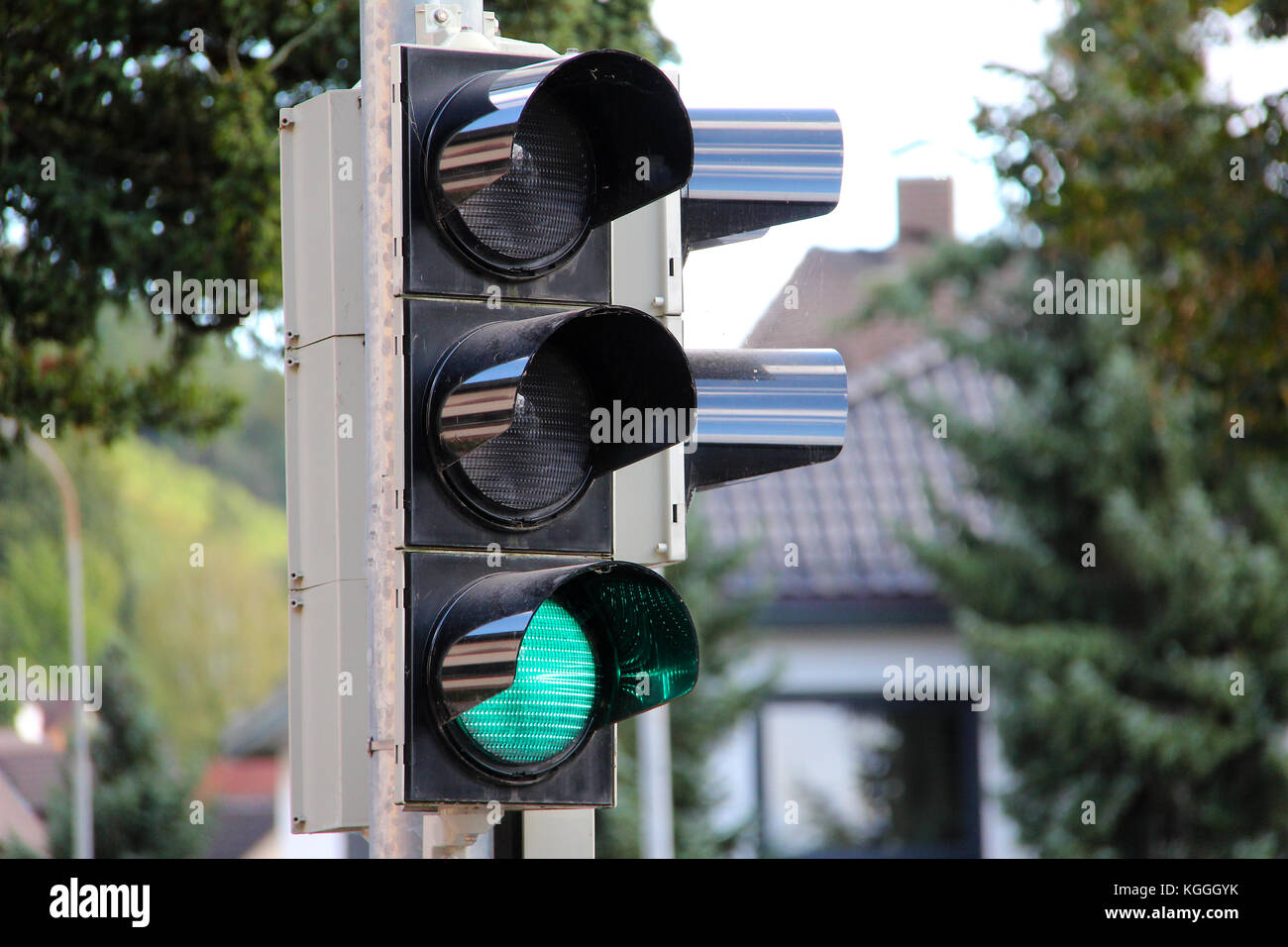 Green / Traffic light installed at the crossroads Stock Photo - Alamy