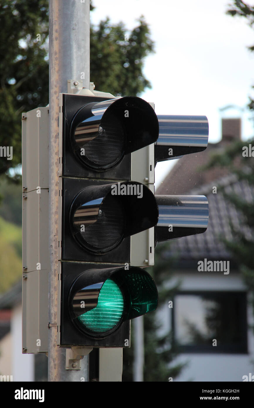 Green / Traffic light installed at the crossroads Stock Photo - Alamy