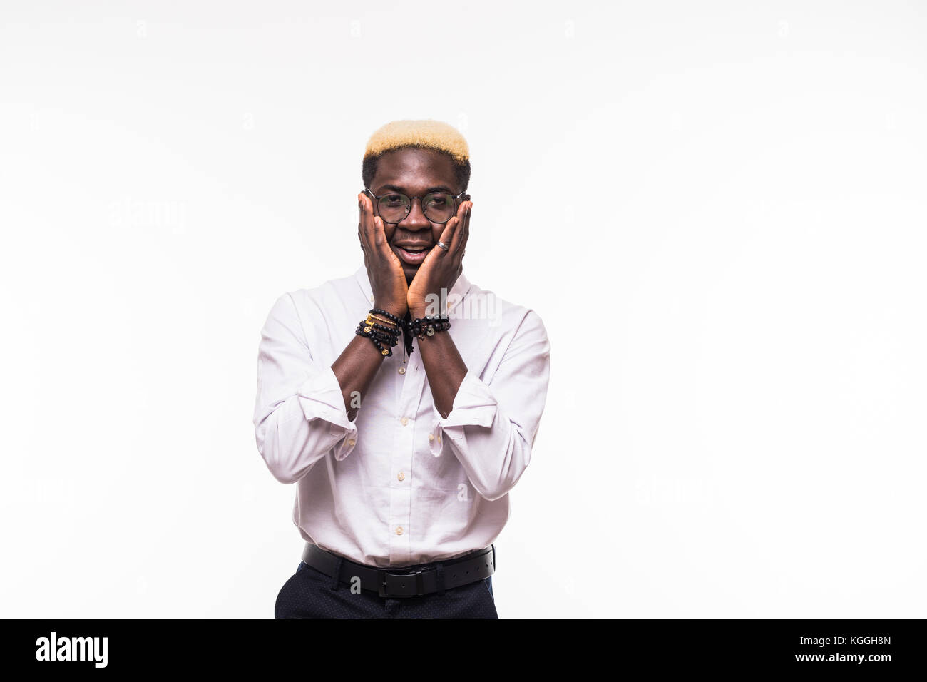 Omg Portrait of astonished and amazed young African man in denim shirt ...