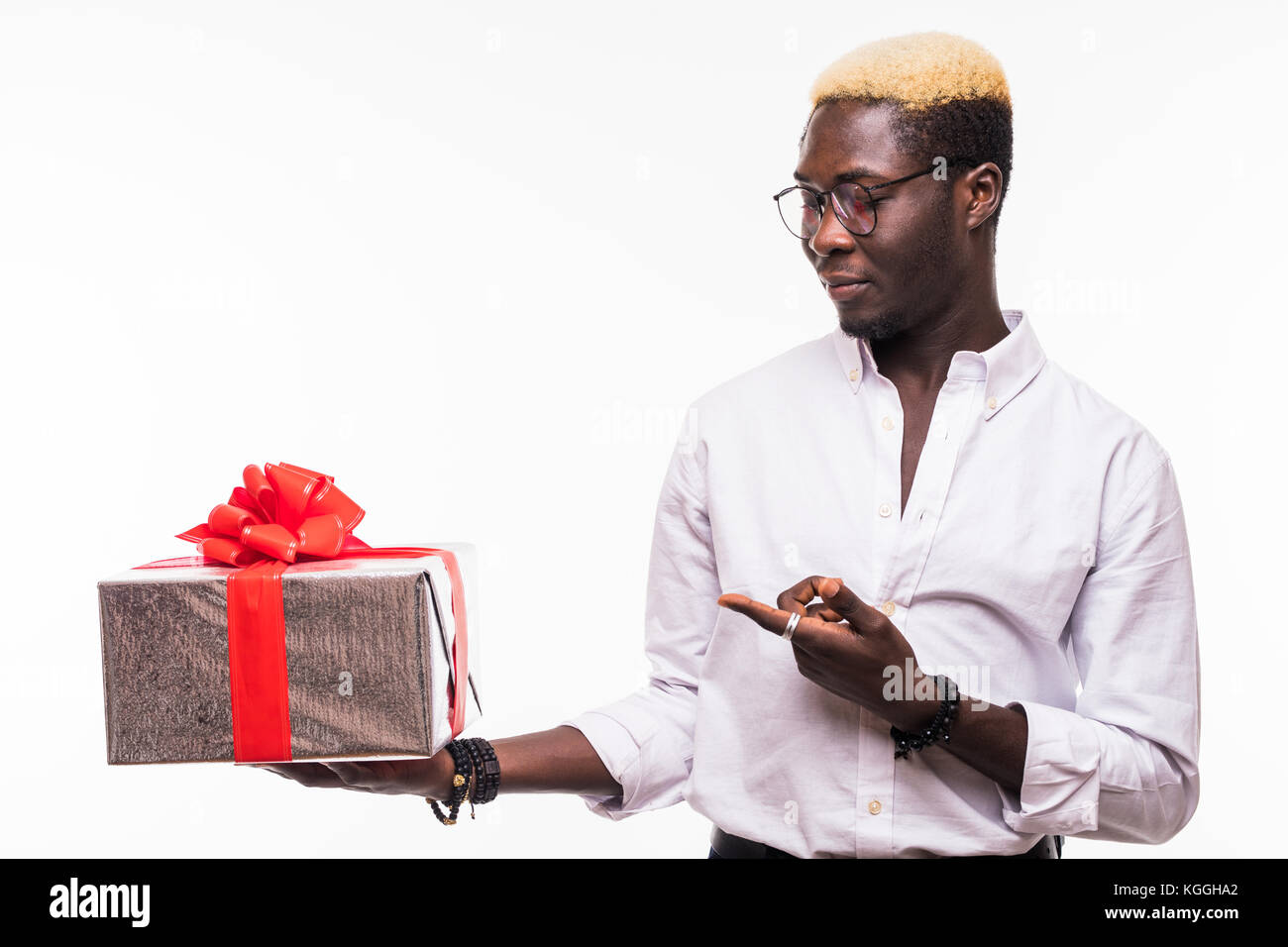 Handsome cool black man with a gift pointed on white background Stock ...