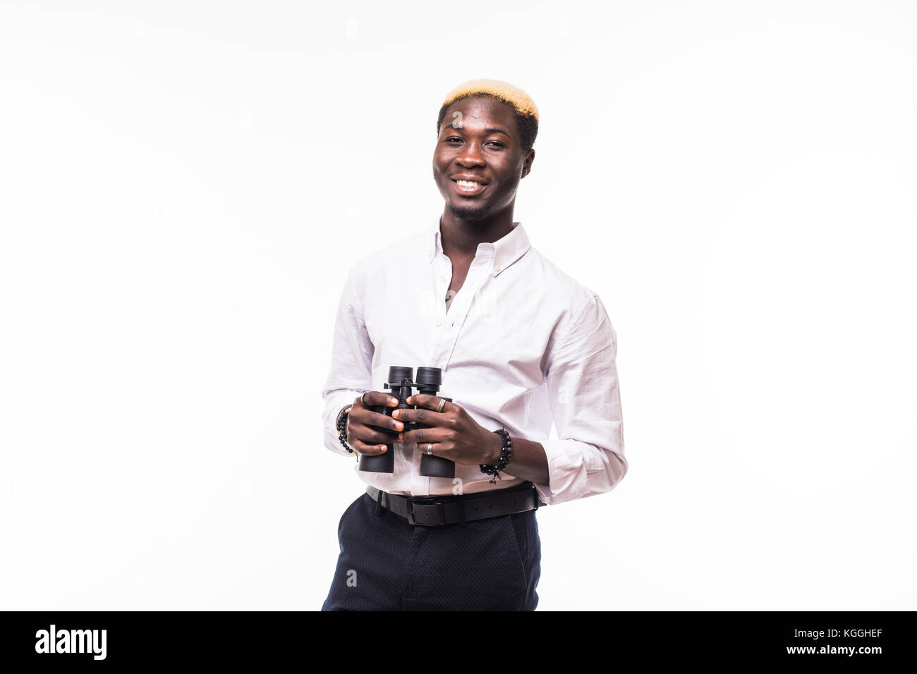 Portrait young handsome focused man looking curious, through fingers ...