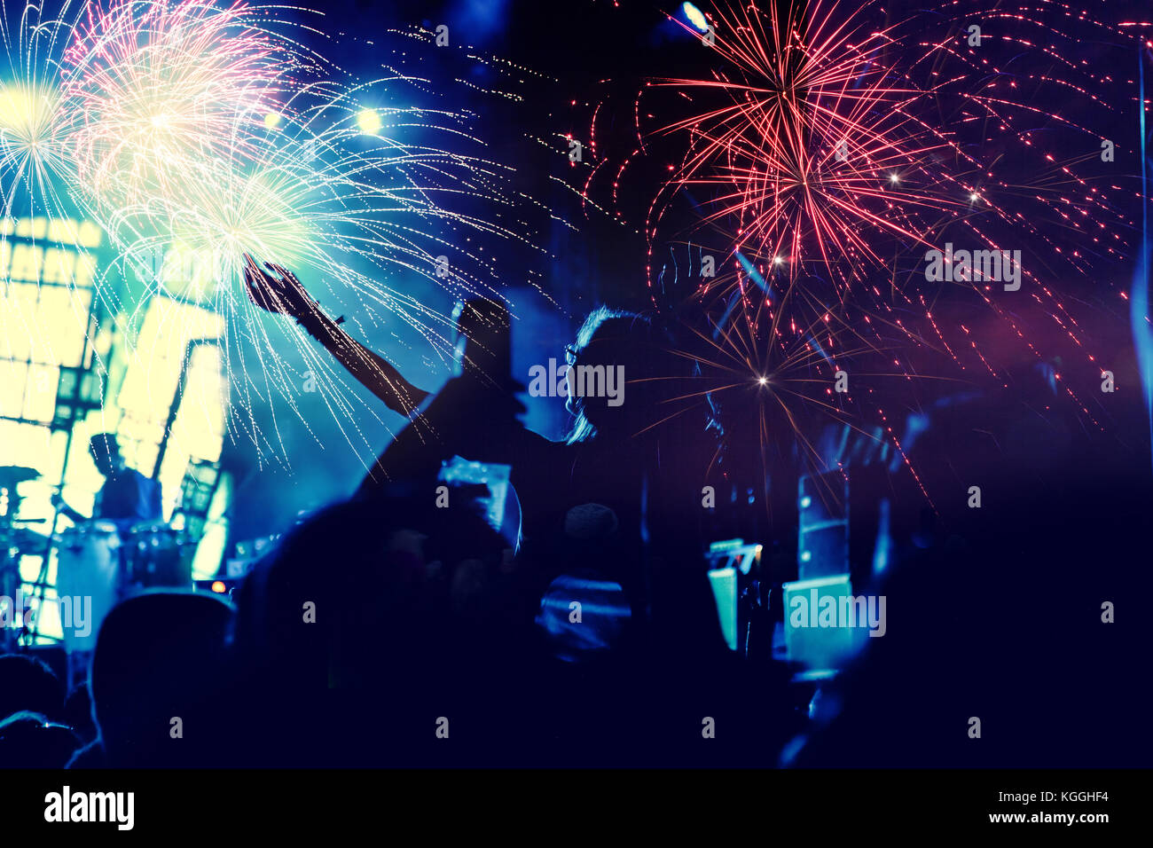 new Year concept - cheering crowd and fireworks Stock Photo - Alamy
