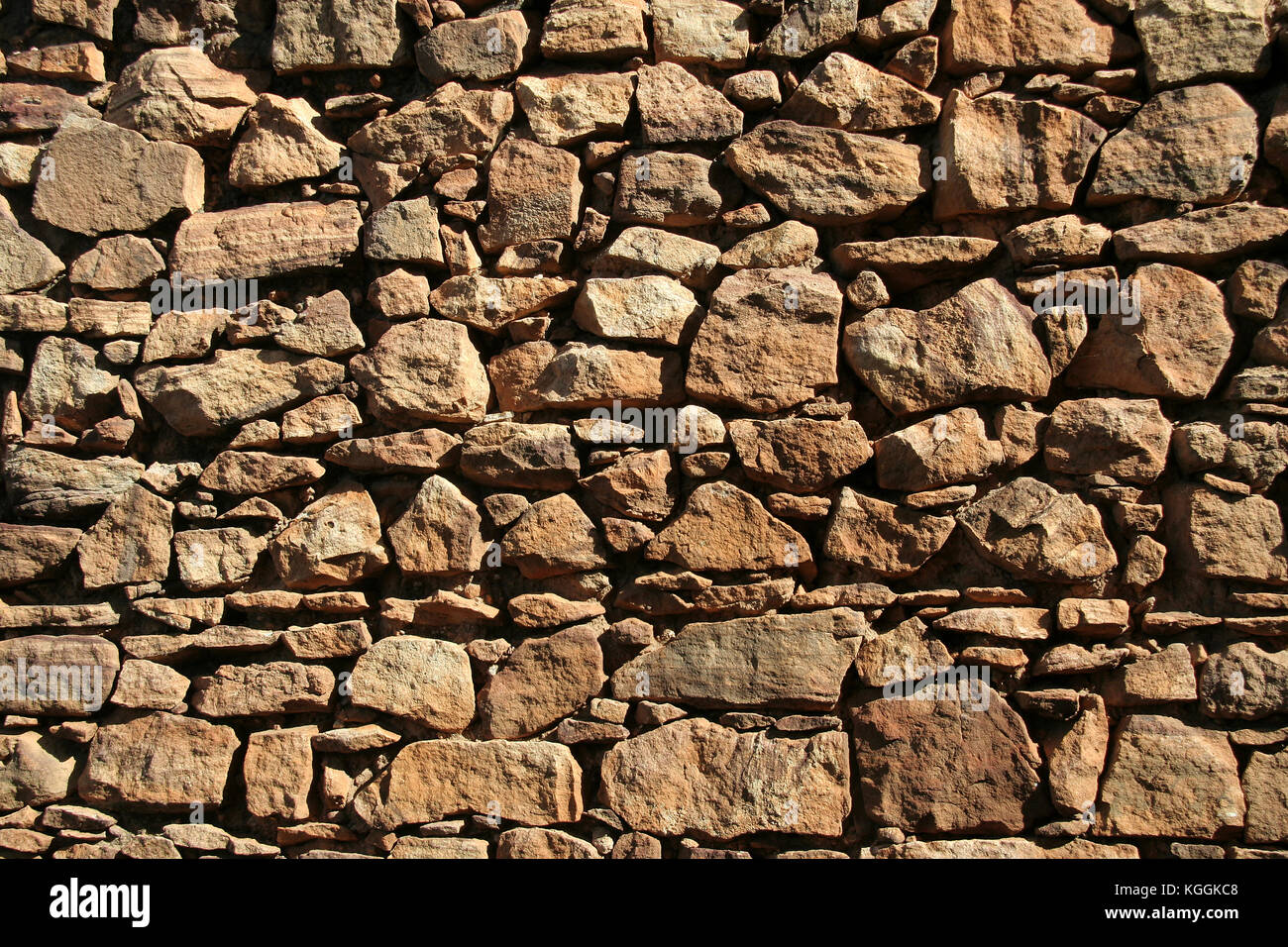 Wall built of stone and rubble without using any mortar Stock Photo - Alamy