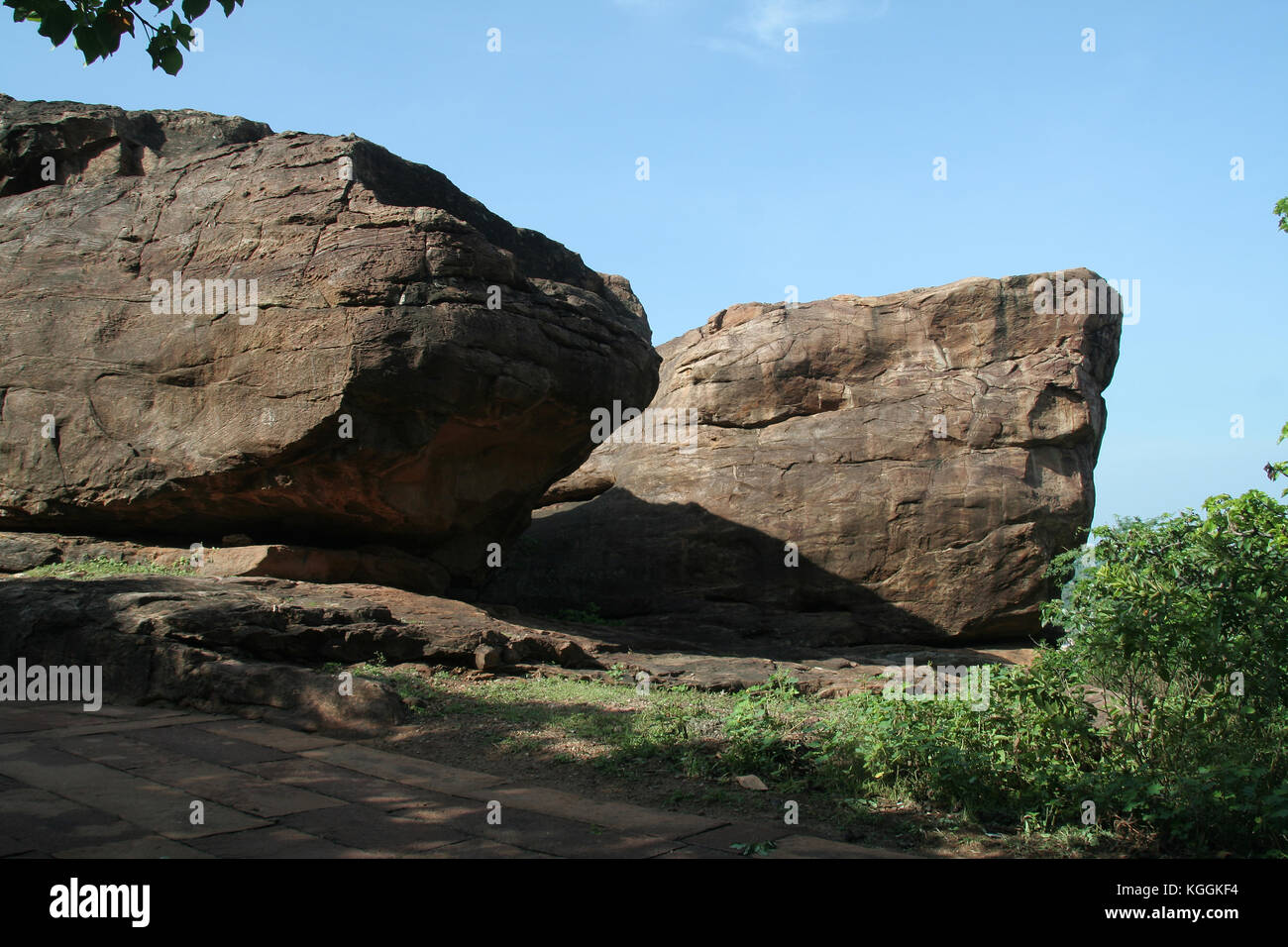 Smooth textured twin rocks in bright morning sunlight Stock Photo - Alamy