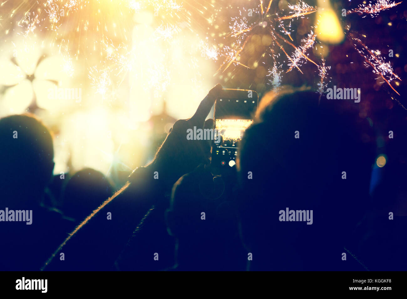 new Year concept - cheering crowd and fireworks Stock Photo - Alamy