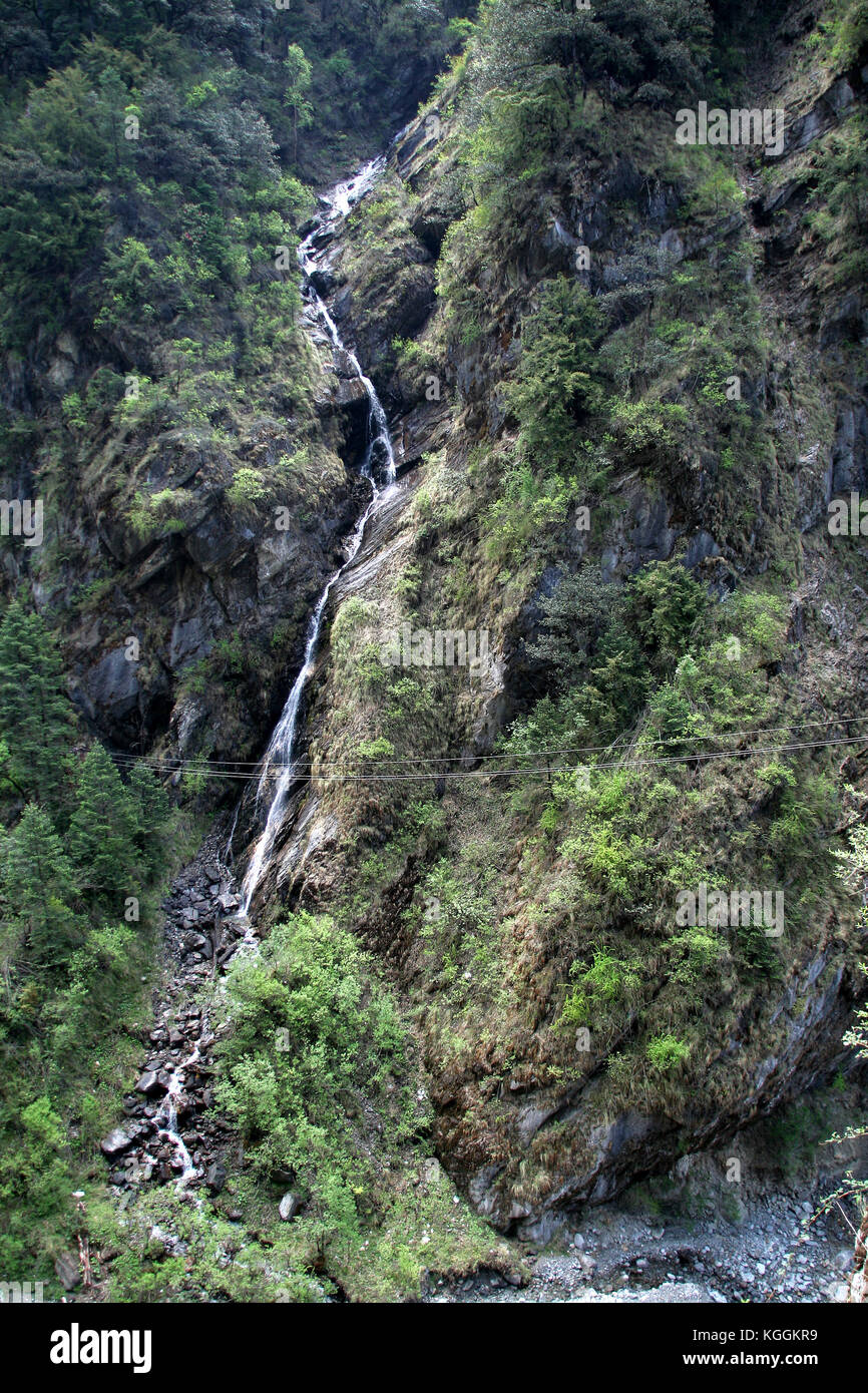 Steep vertical drop from rocky cliff in Yamuna valley near Yamunothri ...
