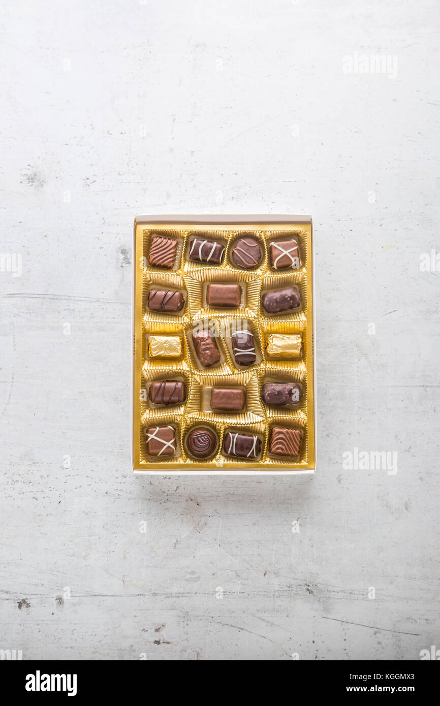 Chocolate pralines. Box of Chocolate Pralines with marzipan Stock Photo ...