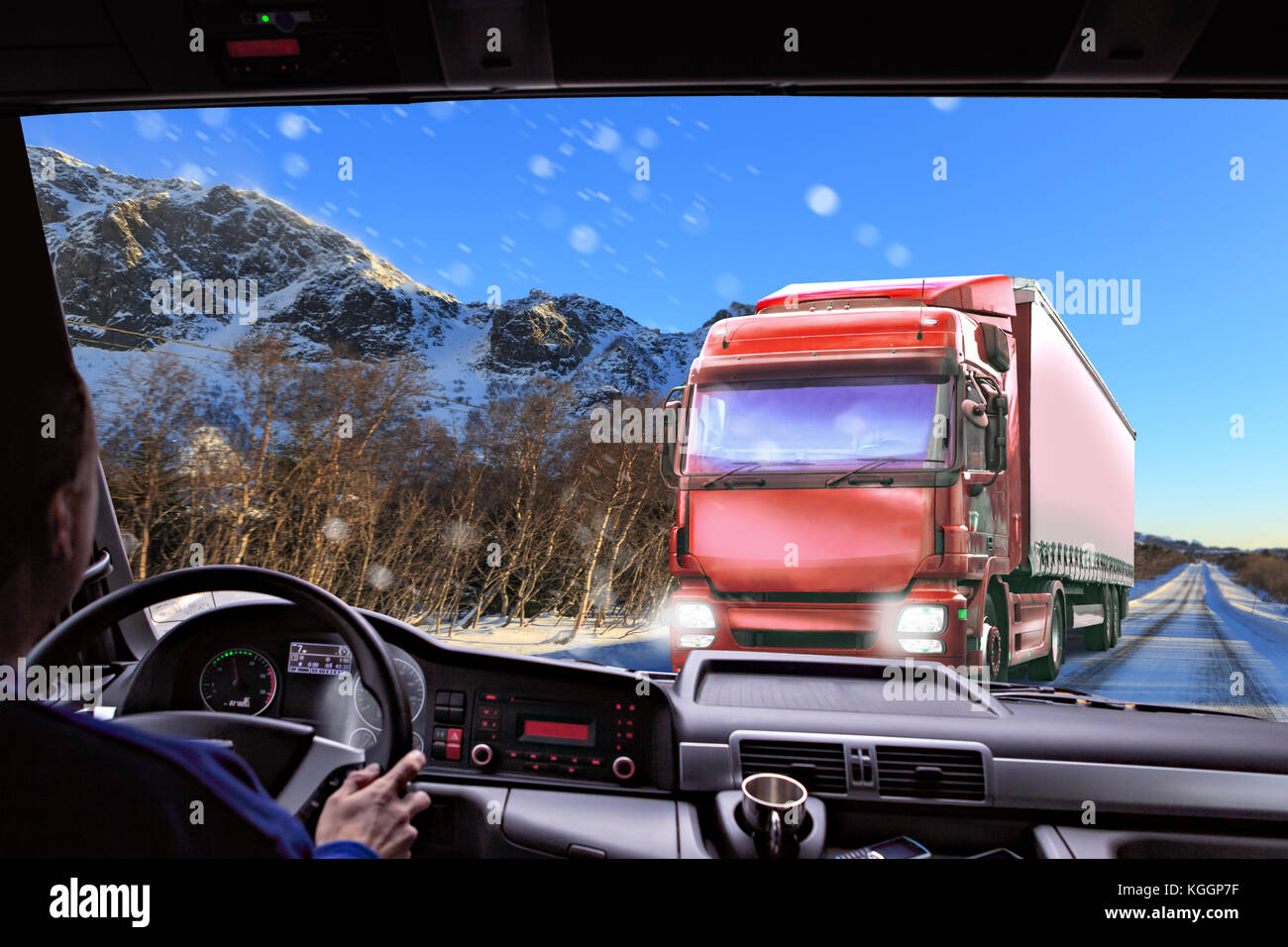 Driver view from the cockpit of a truck on the wintry road, symbolic ...
