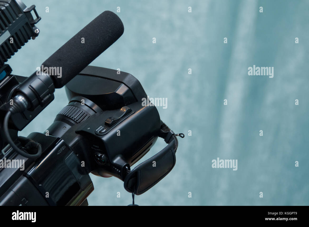 Video camera operator working with his equipment Stock Photo - Alamy