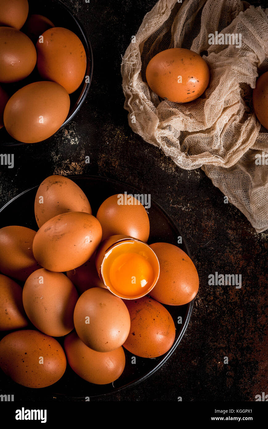 Organic farm chicken eggs, on a plate, on a dark rusty metal background ...