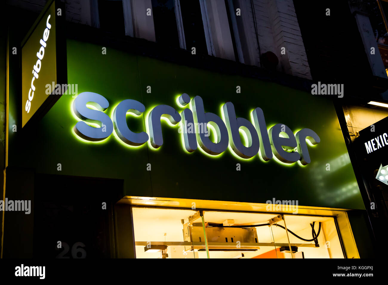 Scribbler store shop front at night Stock Photo - Alamy