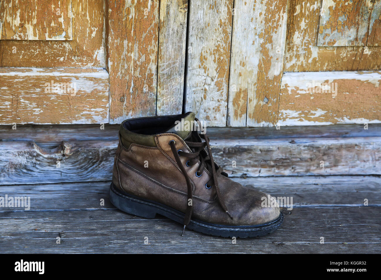 Old shoe on the vintage background Stock Photo - Alamy