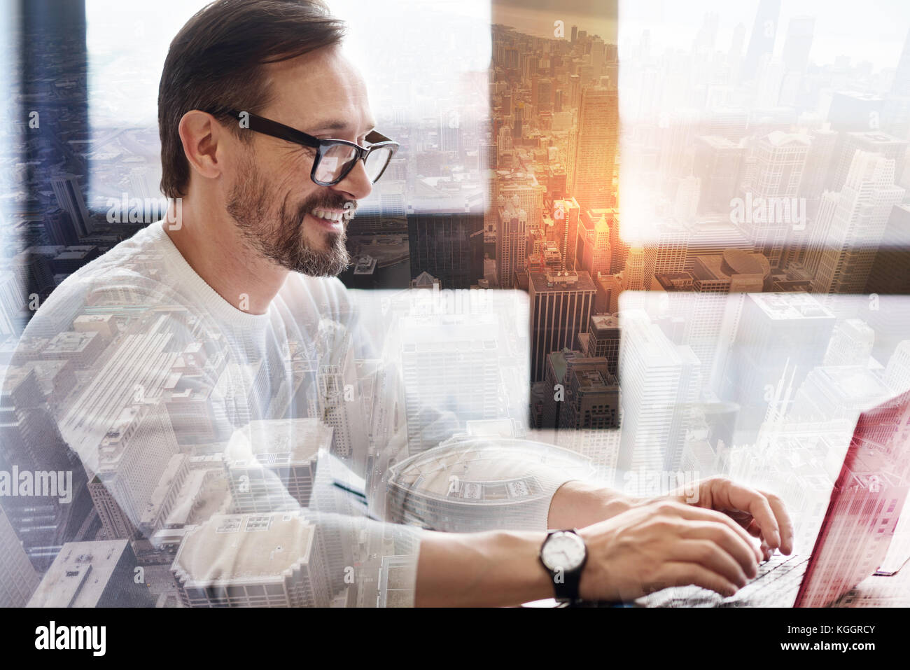 Cheerful young man chatting with his friends on laptop Stock Photo - Alamy