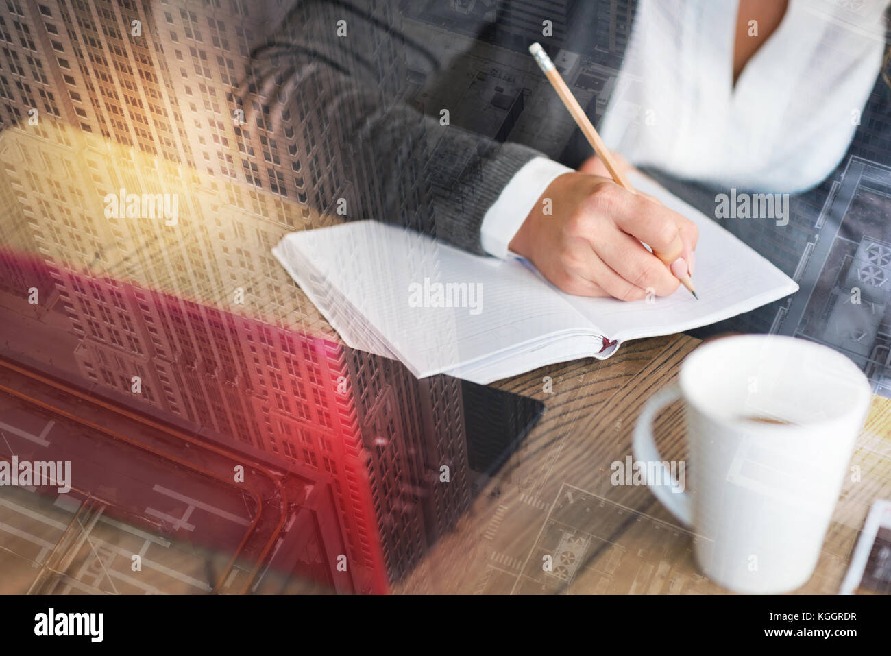 Top view of female hands writing in notebook Stock Photo - Alamy