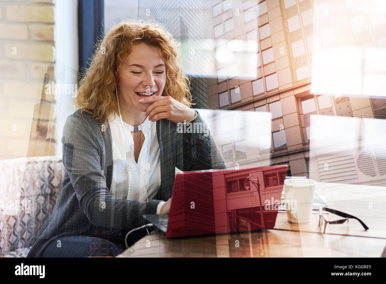 Happy cheerful woman making a video call Stock Photo - Alamy