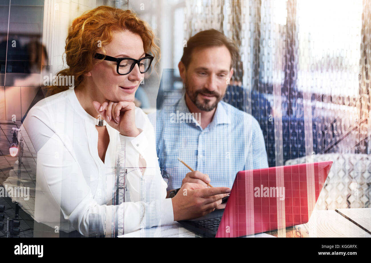 Pleasant woman making remarks on project presentation Stock Photo - Alamy