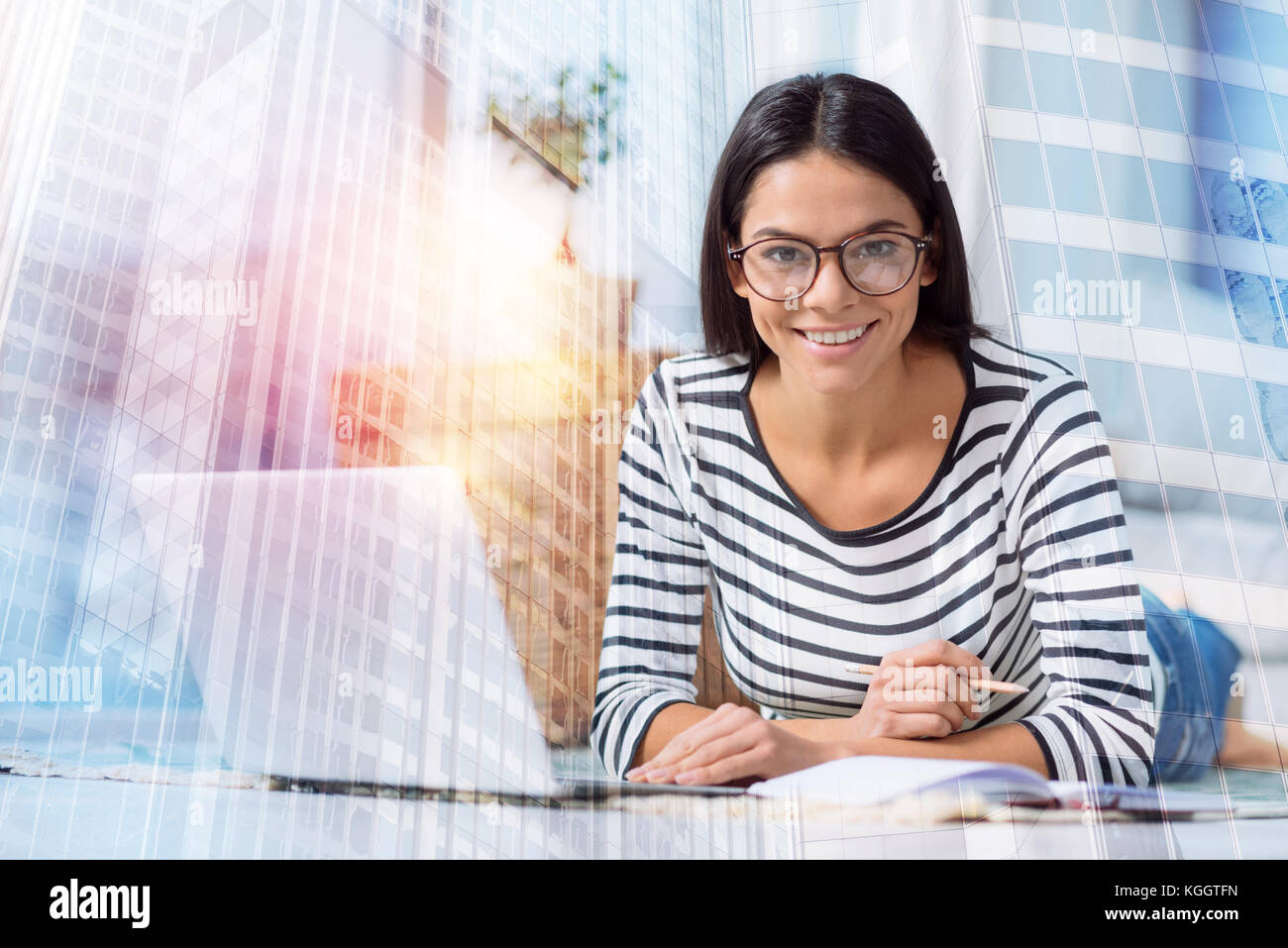 Clever young manager working at home and smiling Stock Photo - Alamy