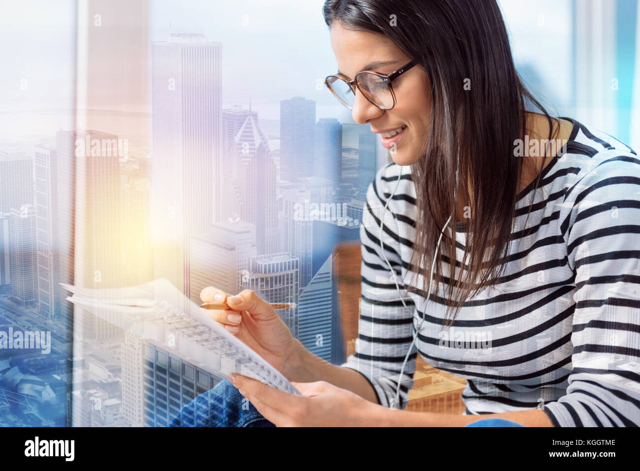 Cheerful smiling student working at her report Stock Photo - Alamy