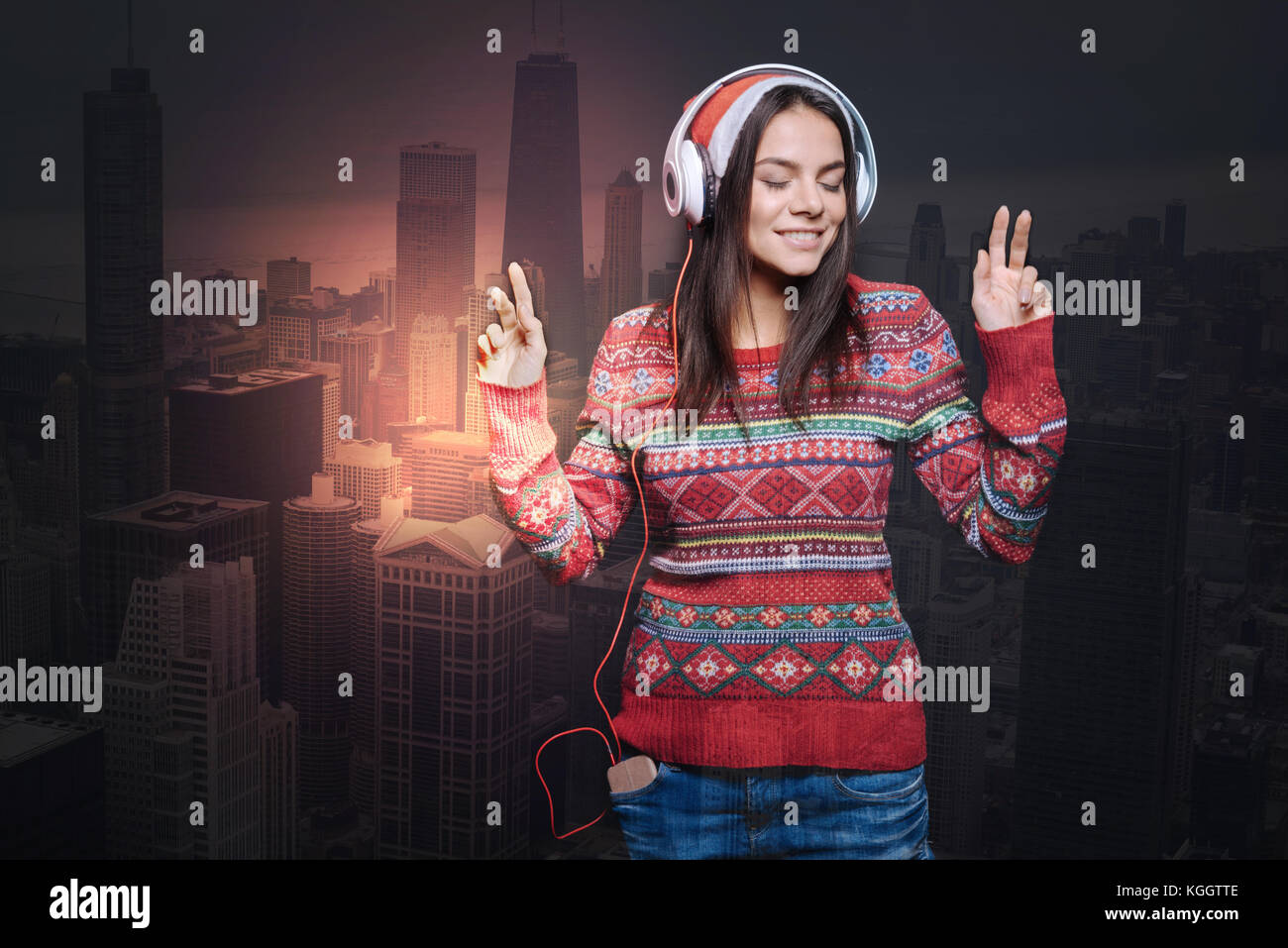 Dancing time. Positive smiling young woman dancing with her eyes closed ...