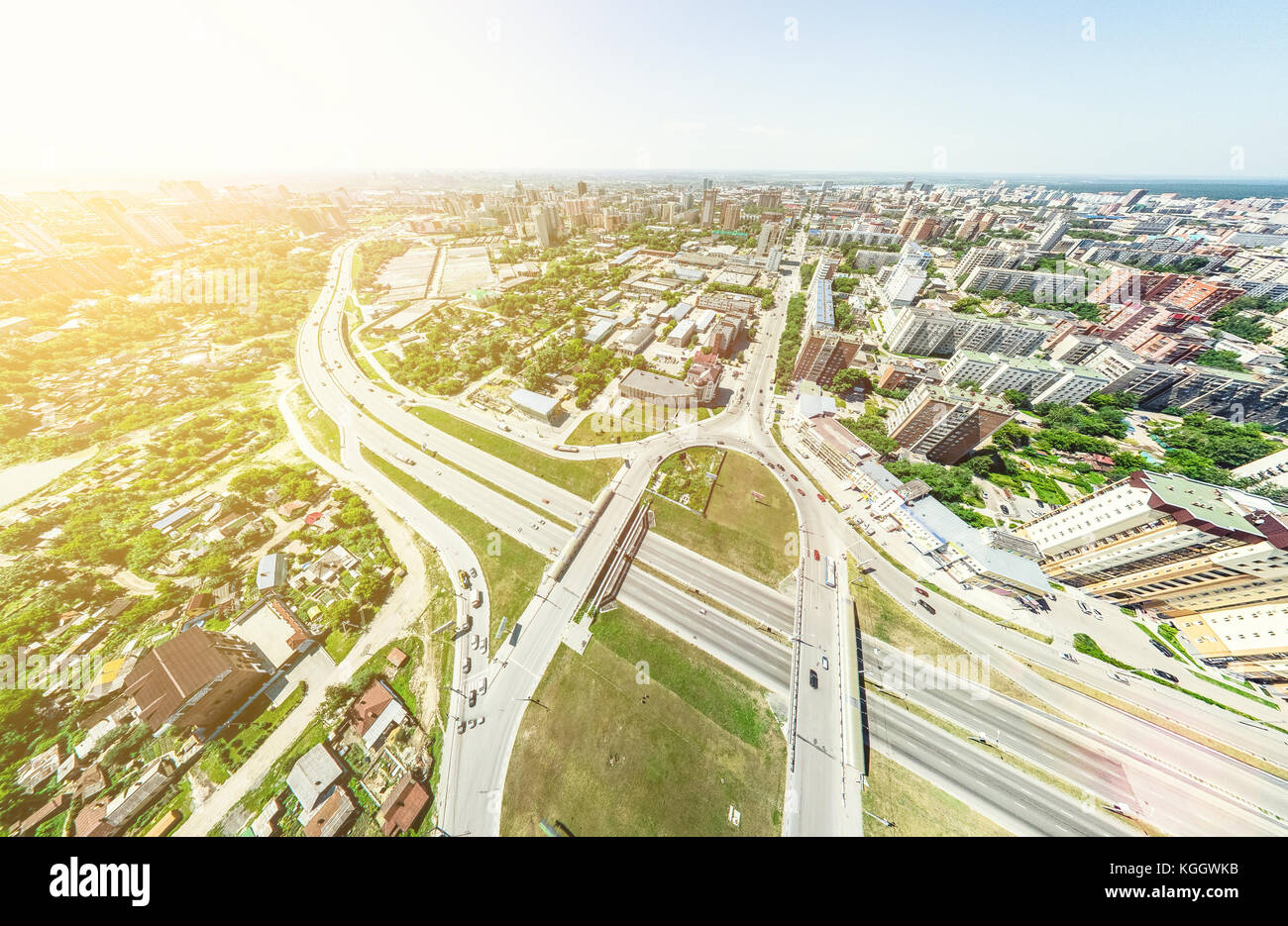 Aerial city view with crossroads and roads, houses, buildings, parks ...