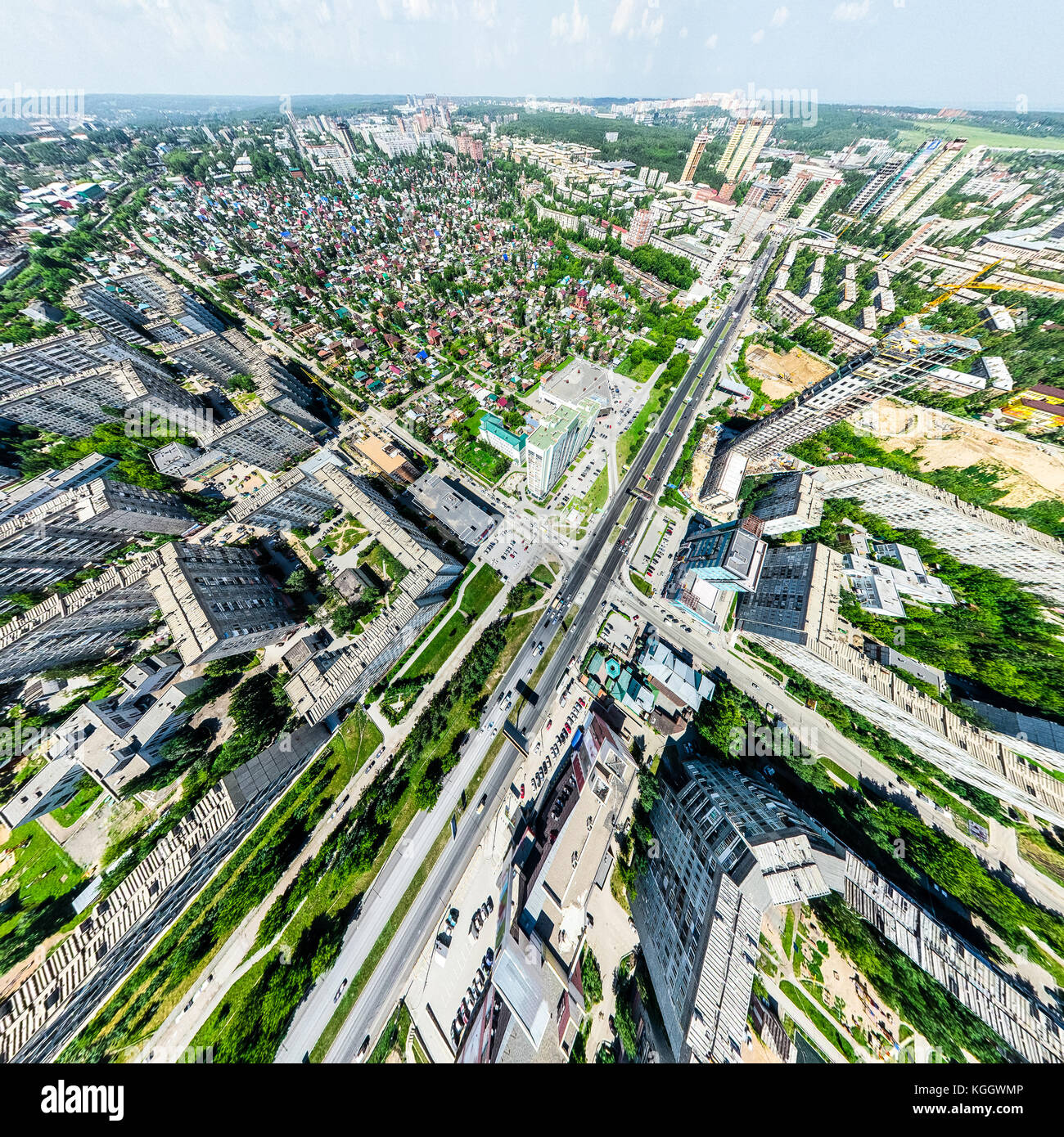 Aerial city view with crossroads and roads, houses, buildings, parks ...