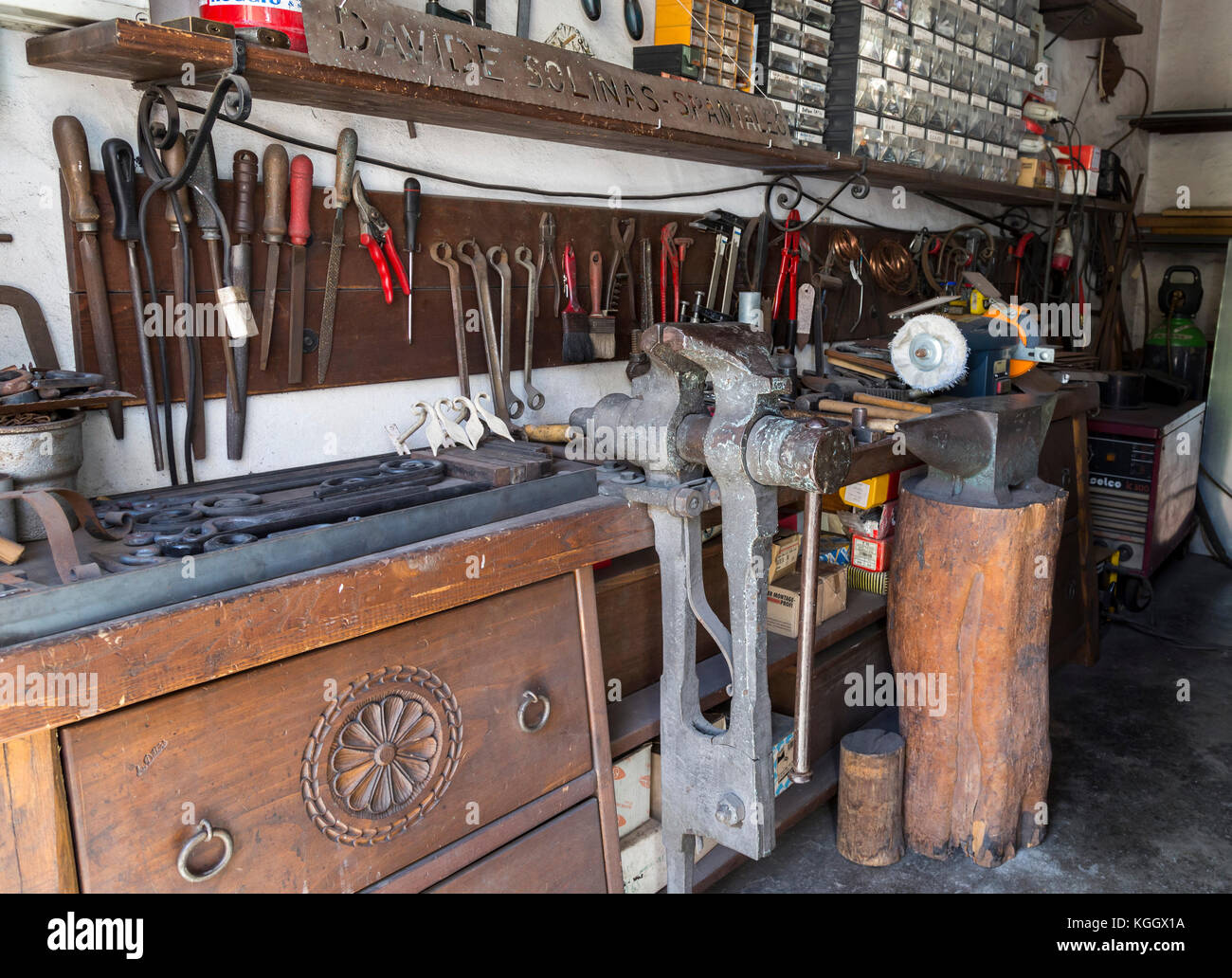 Tools and workbench in a traditional ironmongery workshop Stock Photo ...